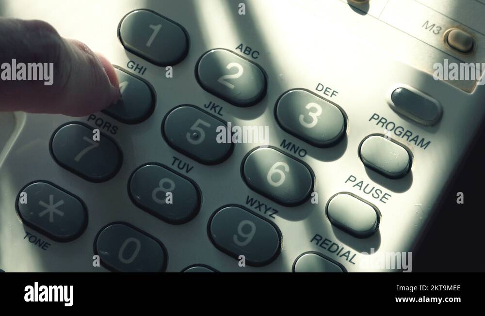 Man dialing random numbers on landline telephone pad Stock Video ...