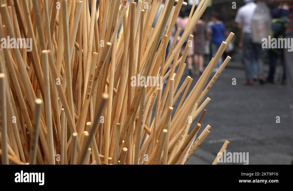 Wooden kebab sticks are collected in garbage cans, street food market ...