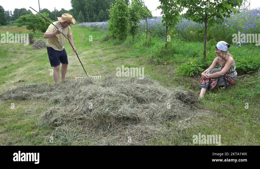 Girl with hay rake Stock Videos & Footage - HD and 4K Video Clips - Alamy