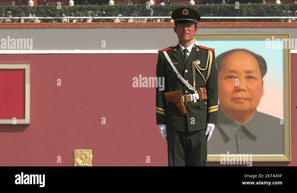 Uniformed soldier standing guard, Mao Zedong portrait, Beijing, China ...