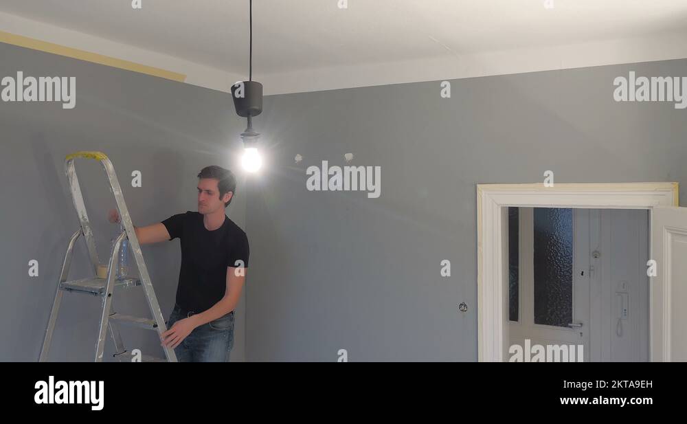 man drinking water on ladder Stock Video Footage - Alamy