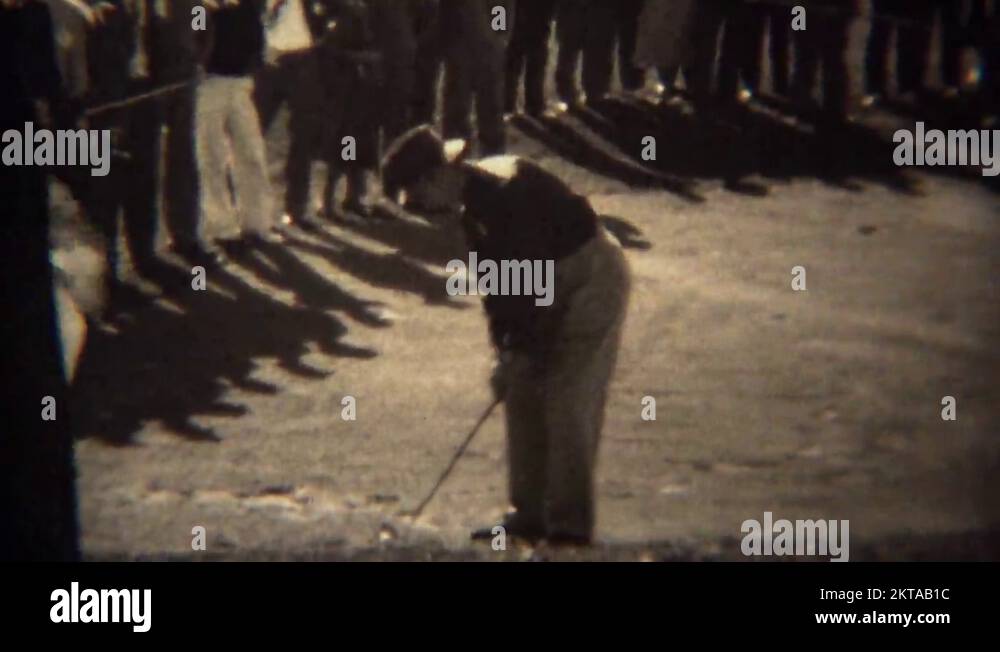 1938: Professional golfer Ralph Guldahl chip shot with crowd surrounded ...
