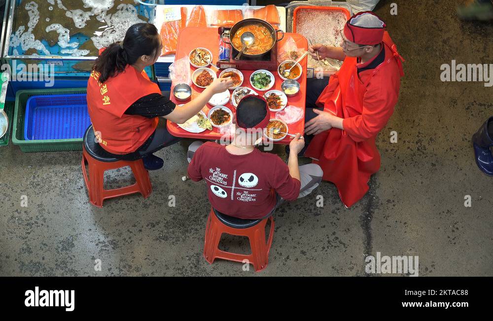 Shop owners at the Noryangjin fish market on a lunch break in Seoul ...