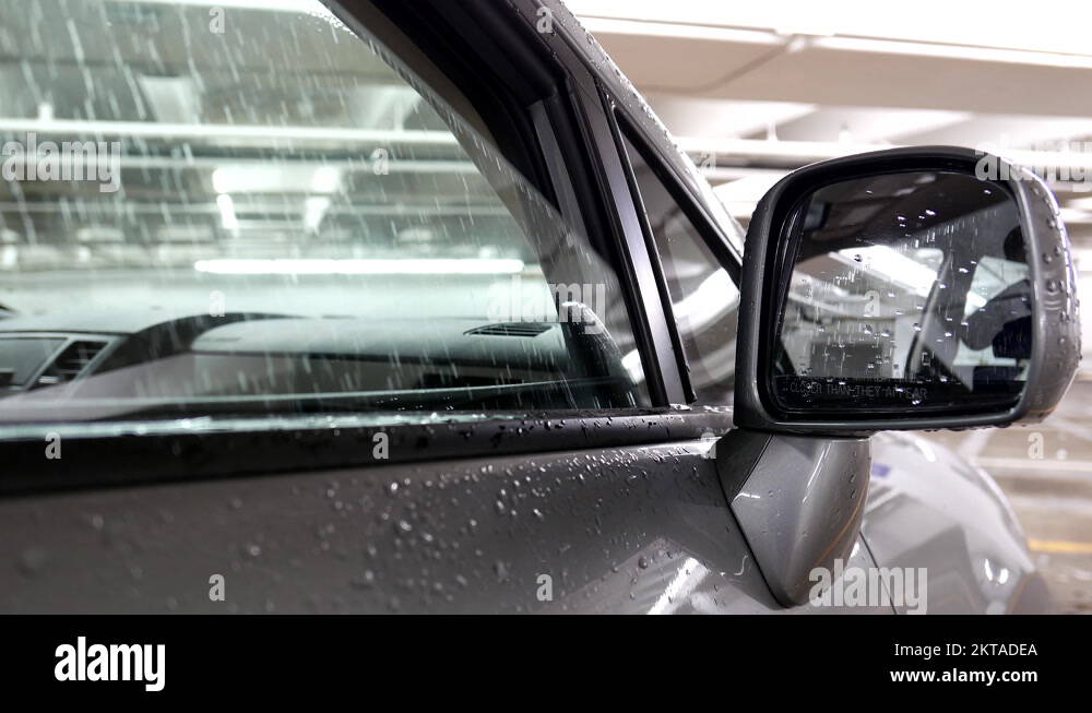 Close up opens window of car inside parking lot with 4k resolution ...