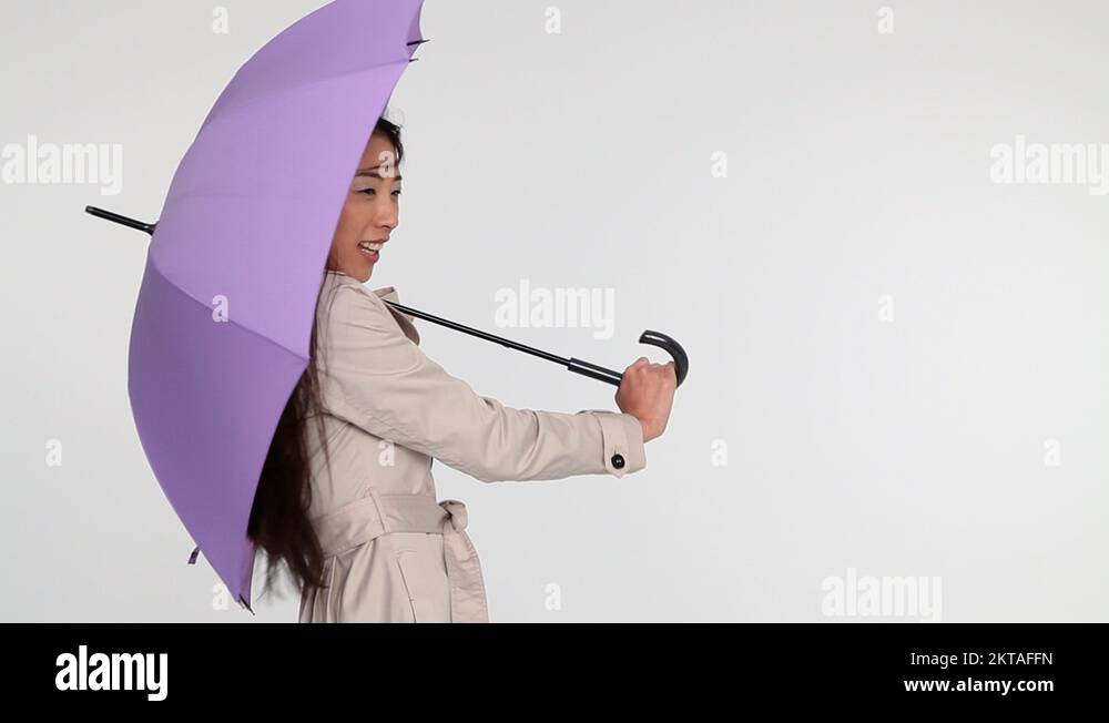 Wind umbrella woman Stock Videos & Footage - HD and 4K Video Clips - Alamy