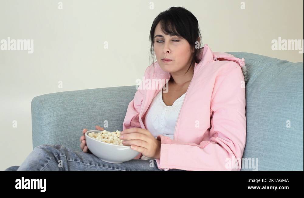 Popcorn girl tv Stock Videos & Footage - HD and 4K Video Clips - Alamy