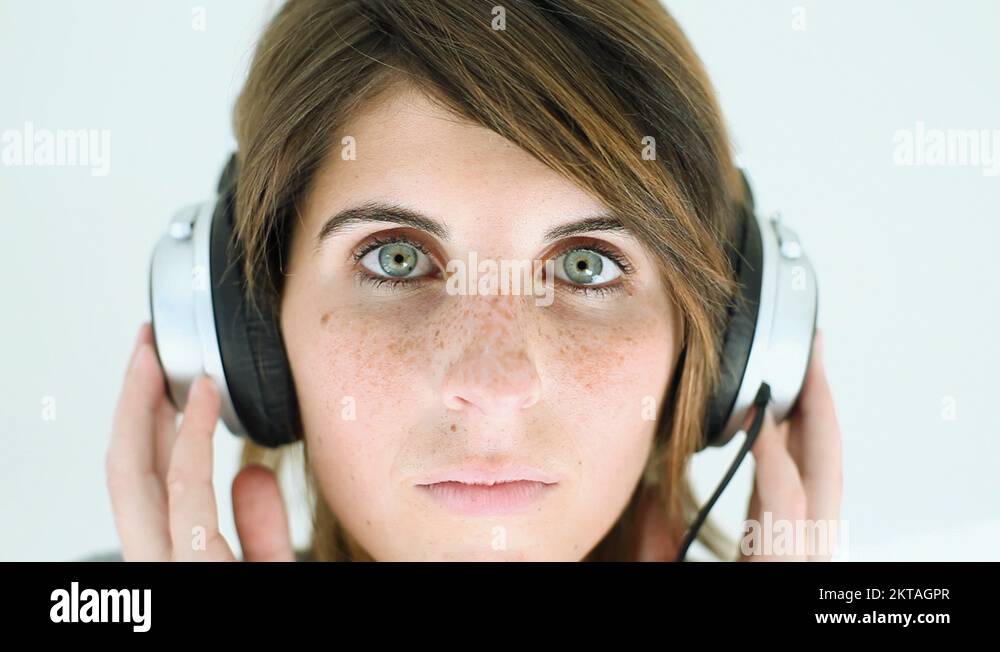 Teenage Girl Wearing Headphones And Listening To Music Stock Video