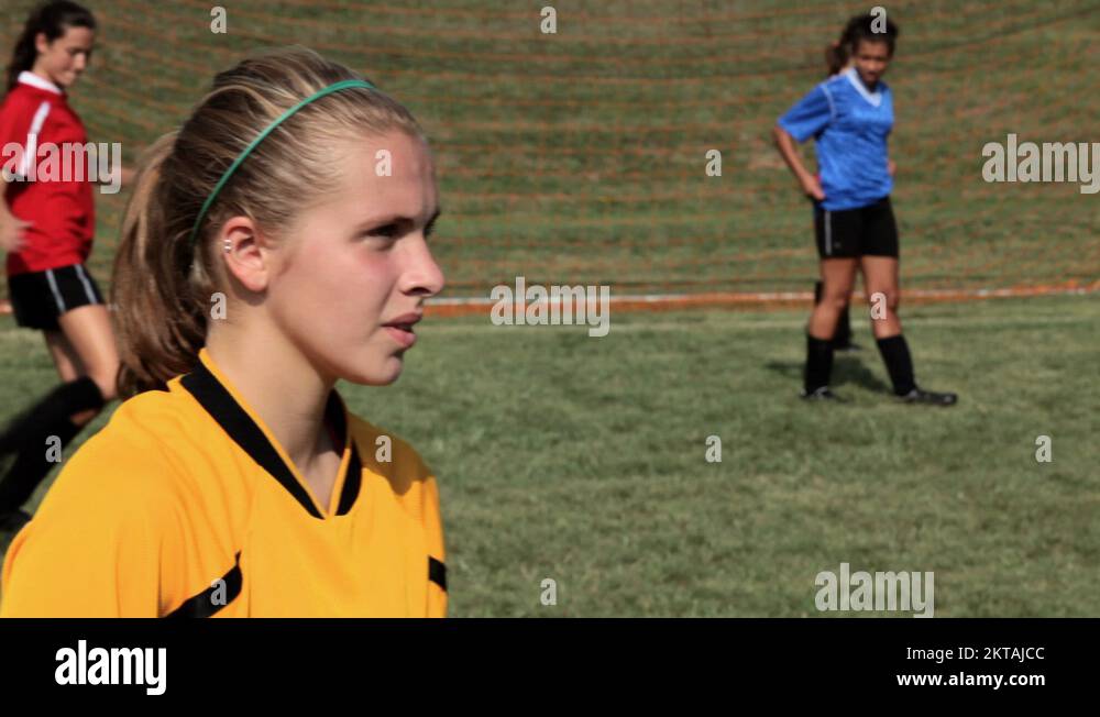 Girl soccer player heading the ball Stock Video Footage - Alamy