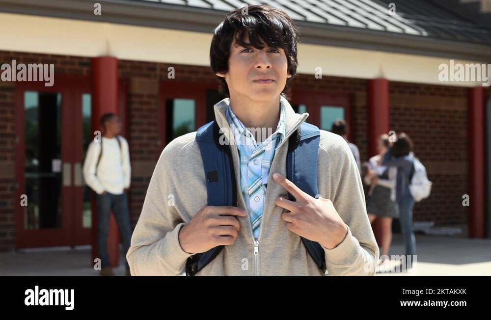 High school student outside school building Stock Video Footage - Alamy