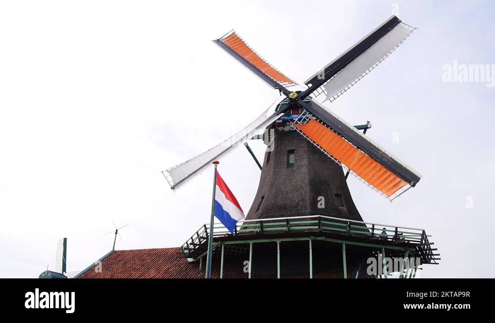 Zaanse Schans, Netherlands, windmill close up spinning with the flag by ...