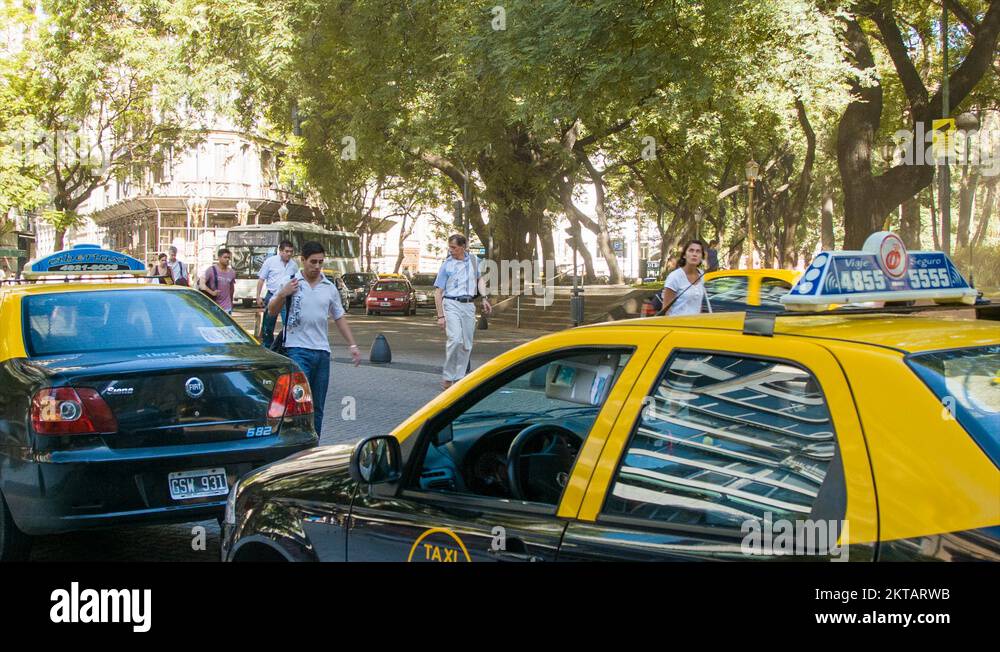 Taxis in Buenos Aires Argentina with Passing People and Public ...