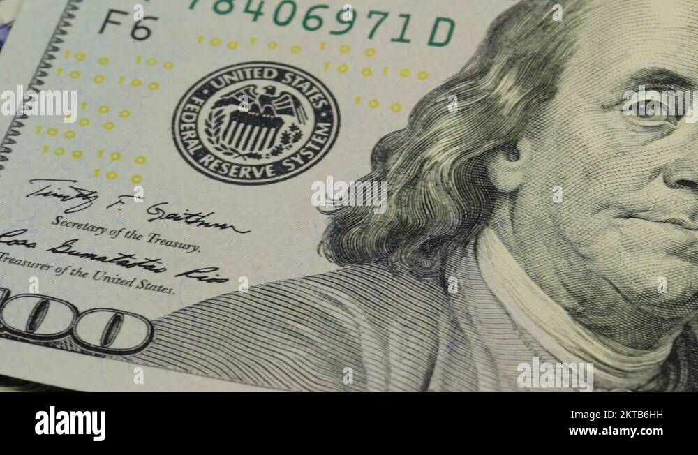 Cash money background. Benjamin Franklin portrait on 100 US dollar bill close up Stock Video ...