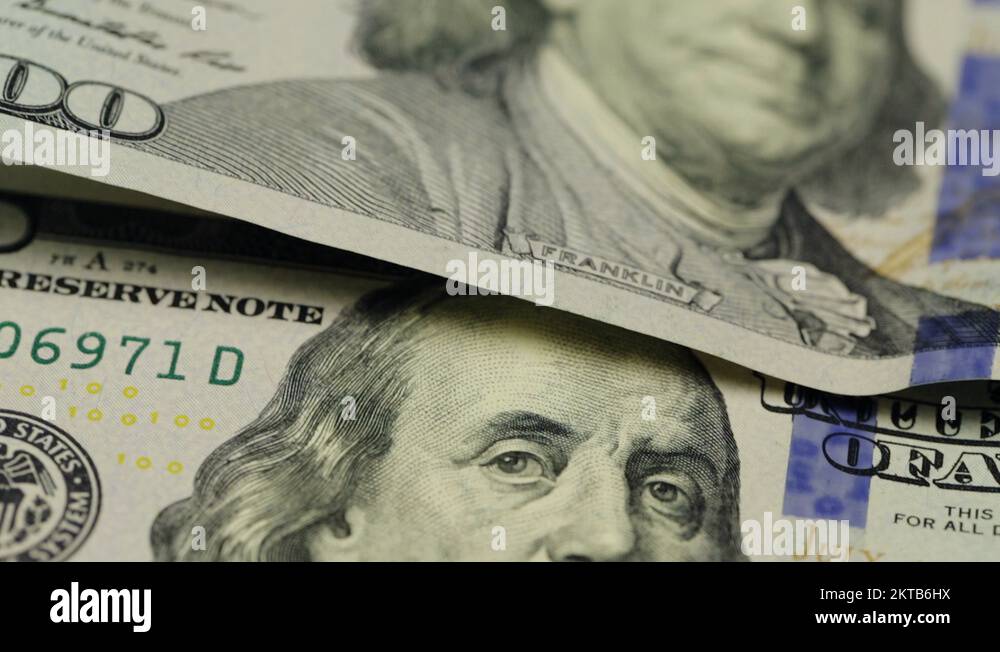 Cash money background. Benjamin Franklin portrait on 100 US dollar bill close up Stock Video ...