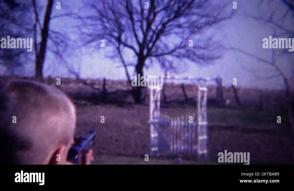 1961: Boy aims shotgun at targets in standing and prone position Stock ...