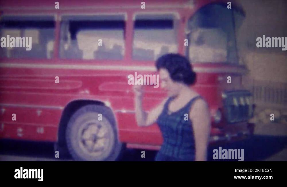 1963: Italian woman grandma wait red tour bus travel sightseeing Stock ...