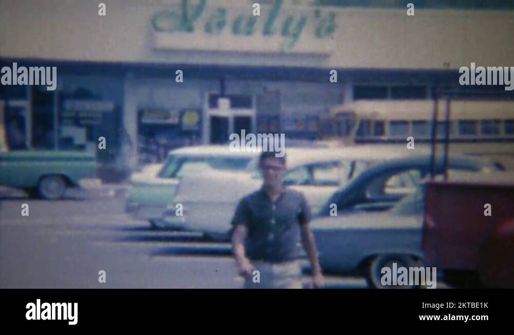 1963: Teenage boy leaving Italy's supermarket store parking lot Stock ...