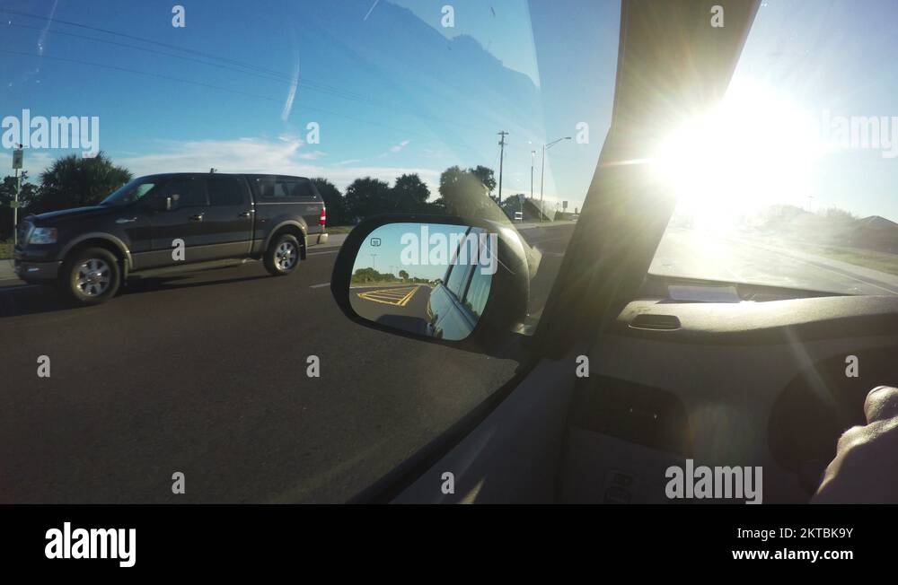 Driving in Car Looking out Rearview Mirror on Bridge Sun Flare, 4K ...