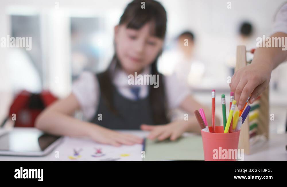 4K Young school children in class with little girl using abacus ...