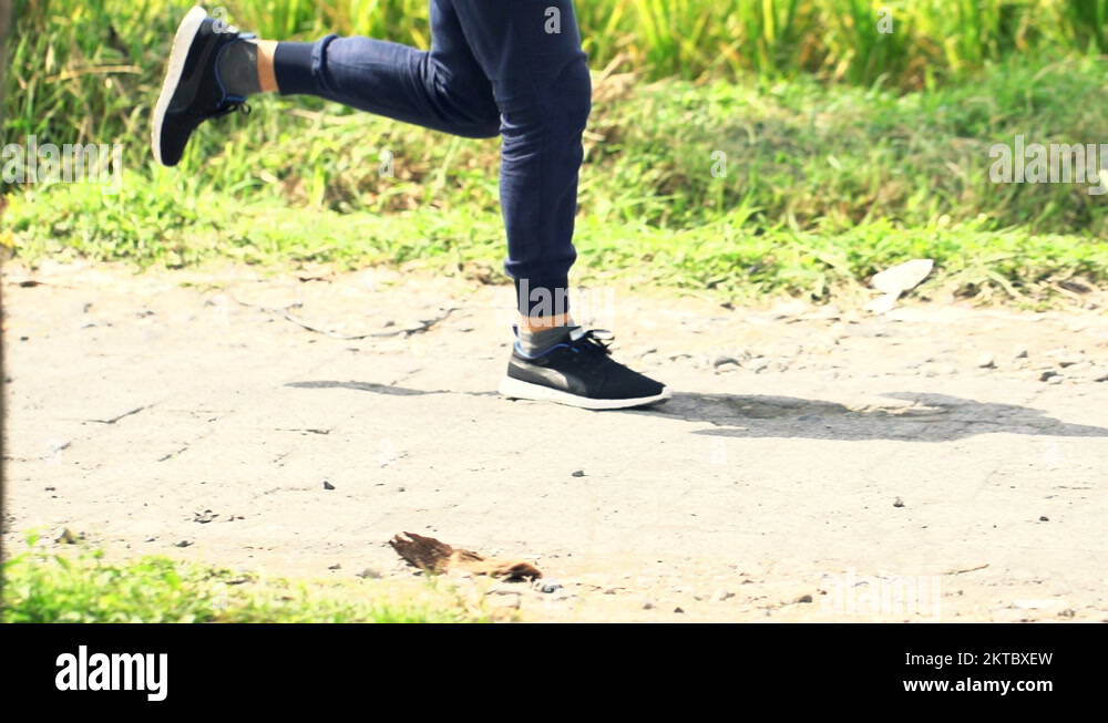 Man jogging on path in park, super slow motion 240fps Stock Video ...