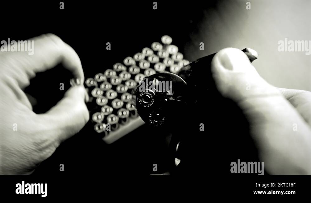 Gun (revolver) Loading (.357) b/w Stock Video Footage - Alamy