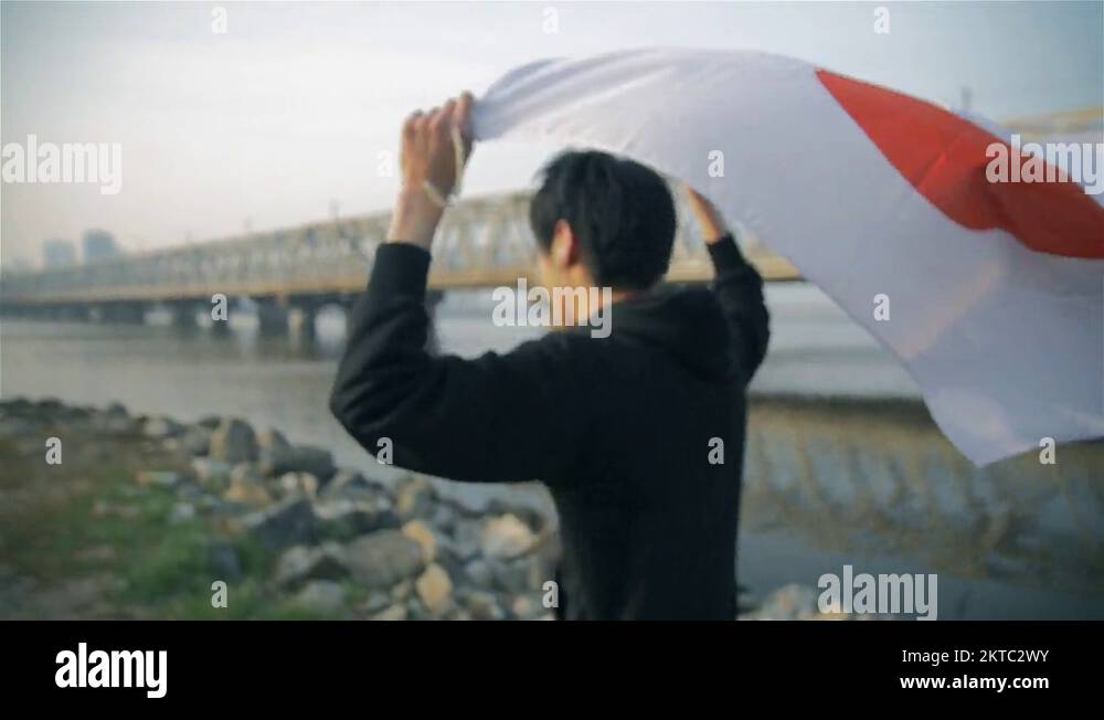 Japanese running man holding national flag while training for big games ...