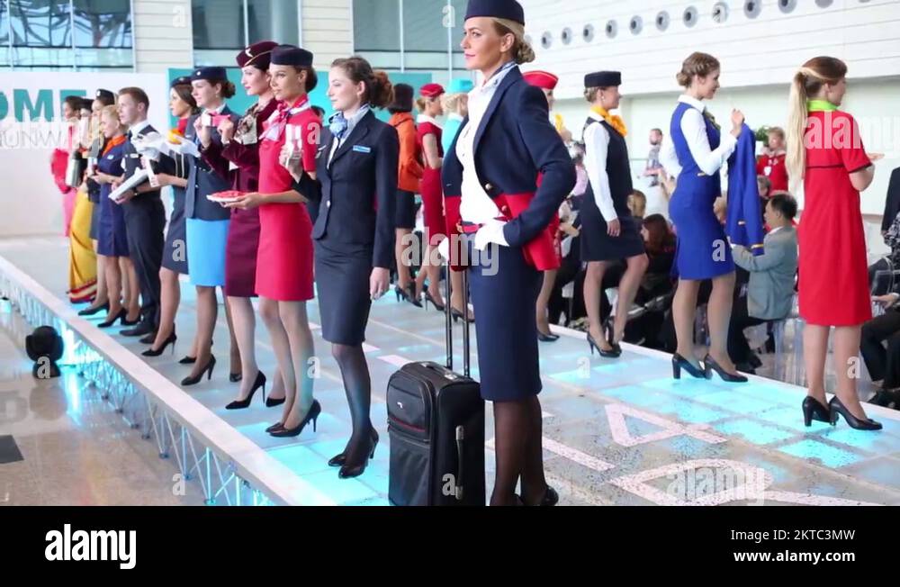 Beautiful women shows a flight attendants uniforms at the fashion show ...