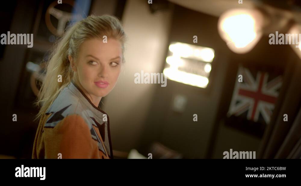 MCU beautiful girl in lounge bar turns and looks off camera 4K Stock ...