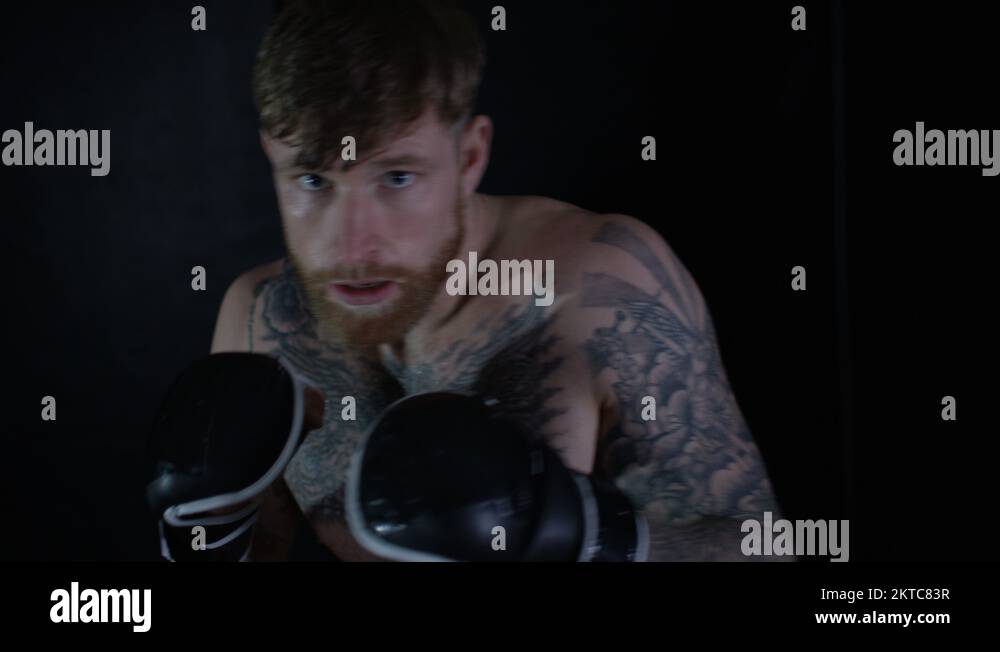 4K Portrait of MMA fighter throwing punches towards camera Stock Video ...