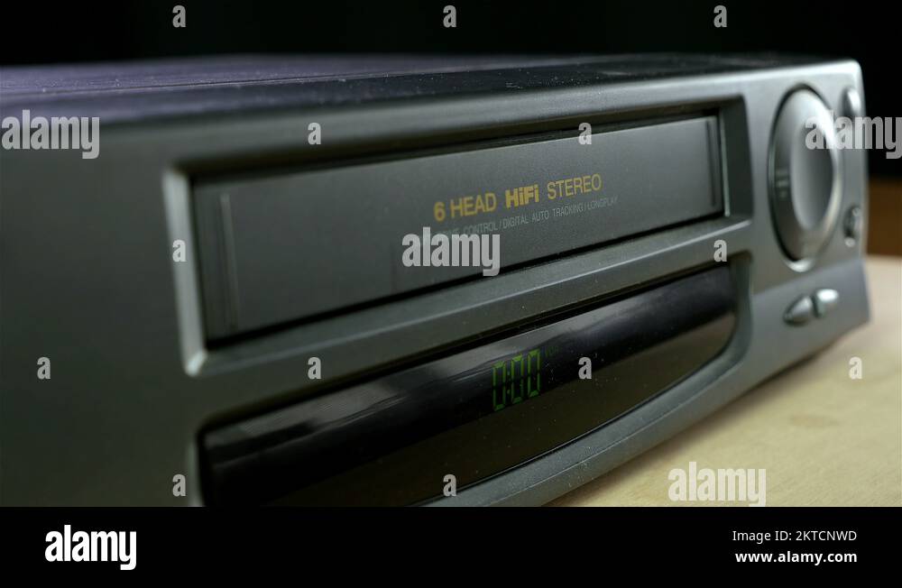 Inserting a VHS Tape into a VCR Player Stock Video Footage - Alamy