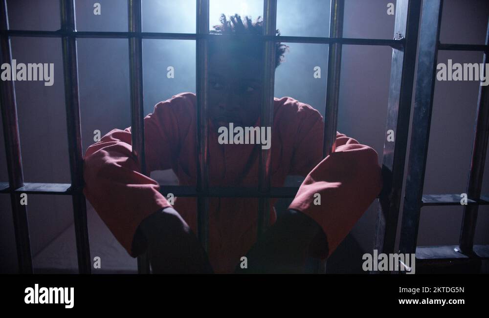 Silhouette of inmate in prison cell Stock Video Footage - Alamy