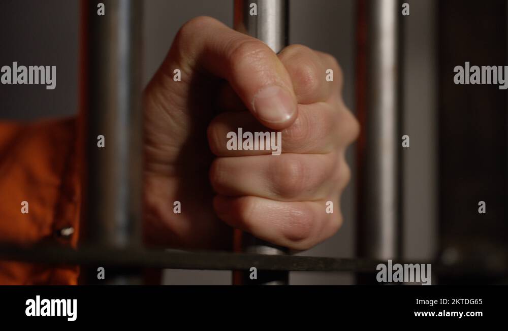 Prison cell bars hand Stock Videos & Footage - HD and 4K Video Clips ...