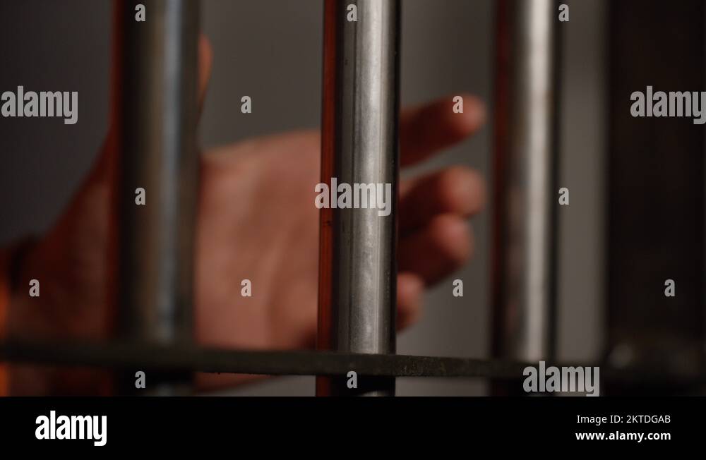 Prison bars hand Stock Videos & Footage - HD and 4K Video Clips - Alamy