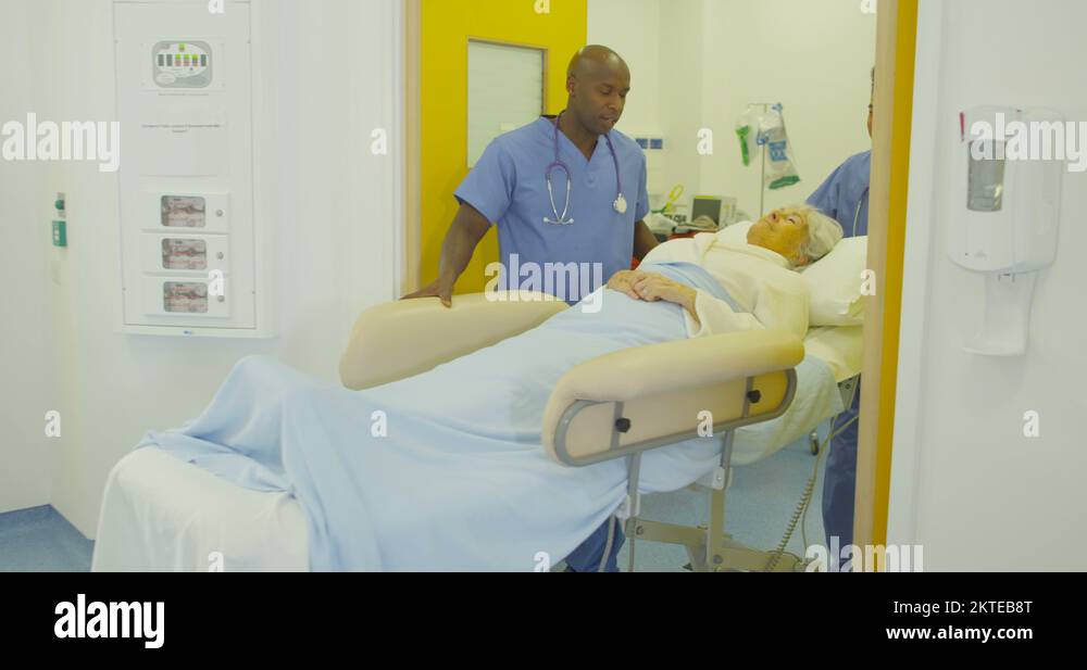 4K Friendly medical workers taking care of patients in modern hospital ...