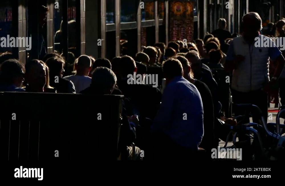 Crowd of people sitting outdoor in a bar-cafe-restaurant drinking ...