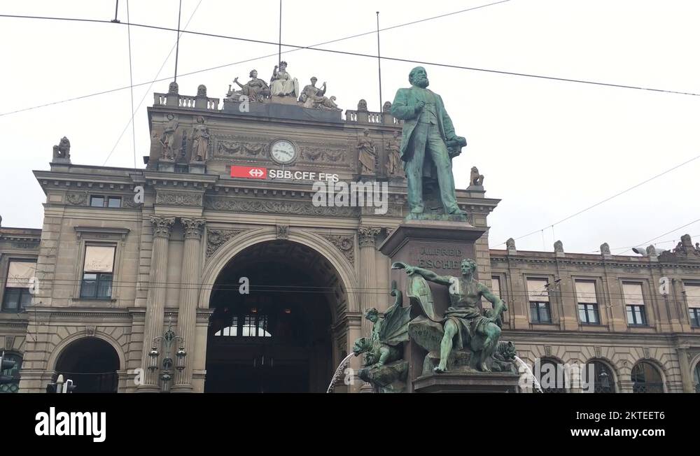 Down tilt of Statue of Alfred Escher in front of the Zurich grand ...