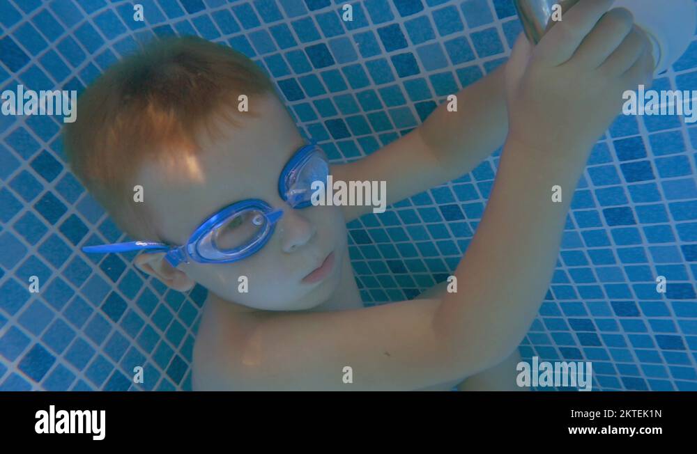 Boy in Goggles Holding Breath in Swimming Pool Stock Video Footage - Alamy