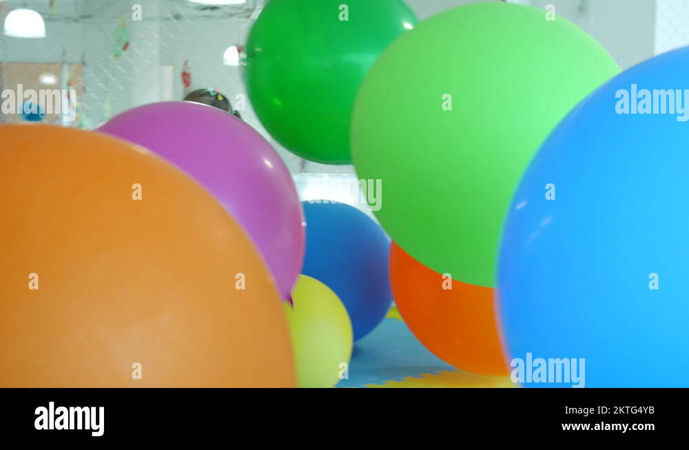 Children playground little kid girl run play in room with big colored ...