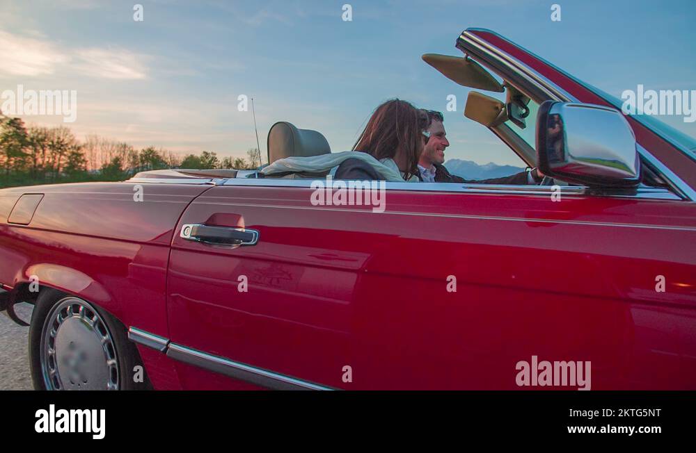 Driving in a red car with open roof Stock Video Footage - Alamy