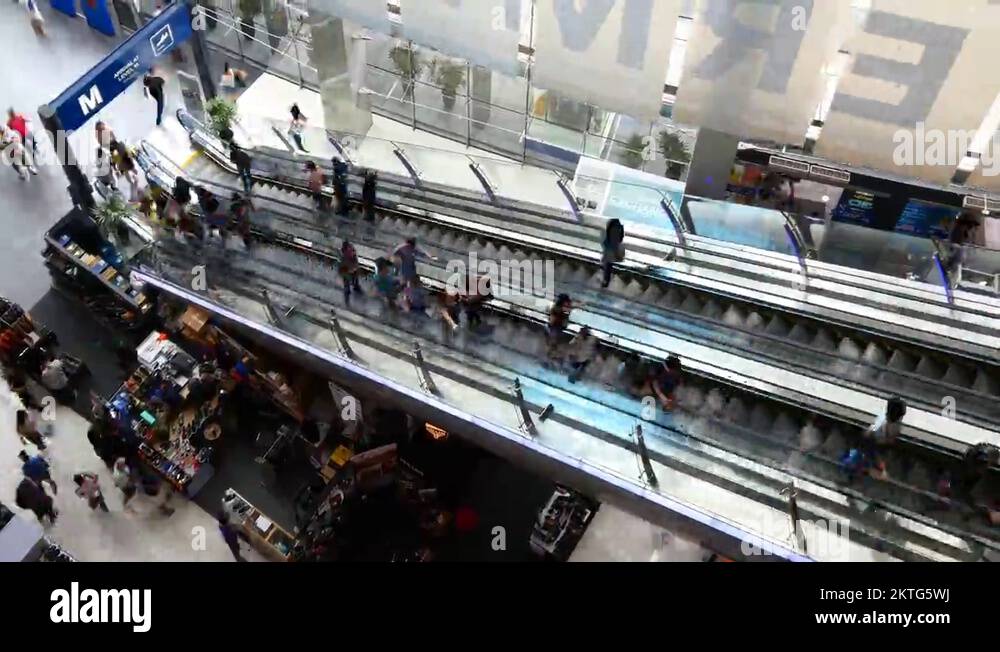 Escalator 4k shopping mall crowd of people buy shop center centre sales shops Stock Video ...