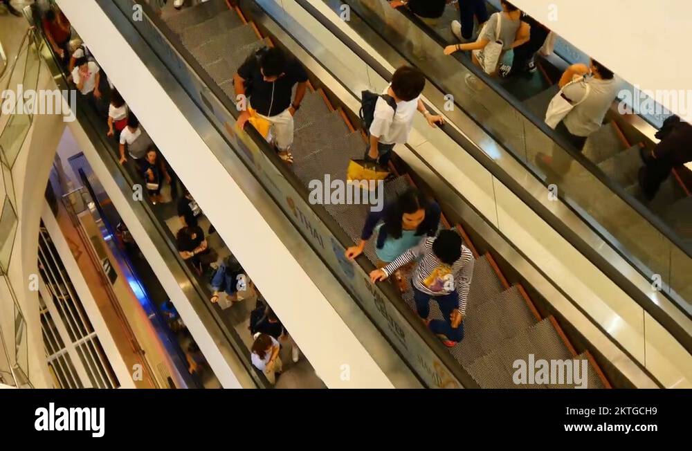 Escalator 4k shopping mall crowd of people buy shop center centre sales shops Stock Video ...