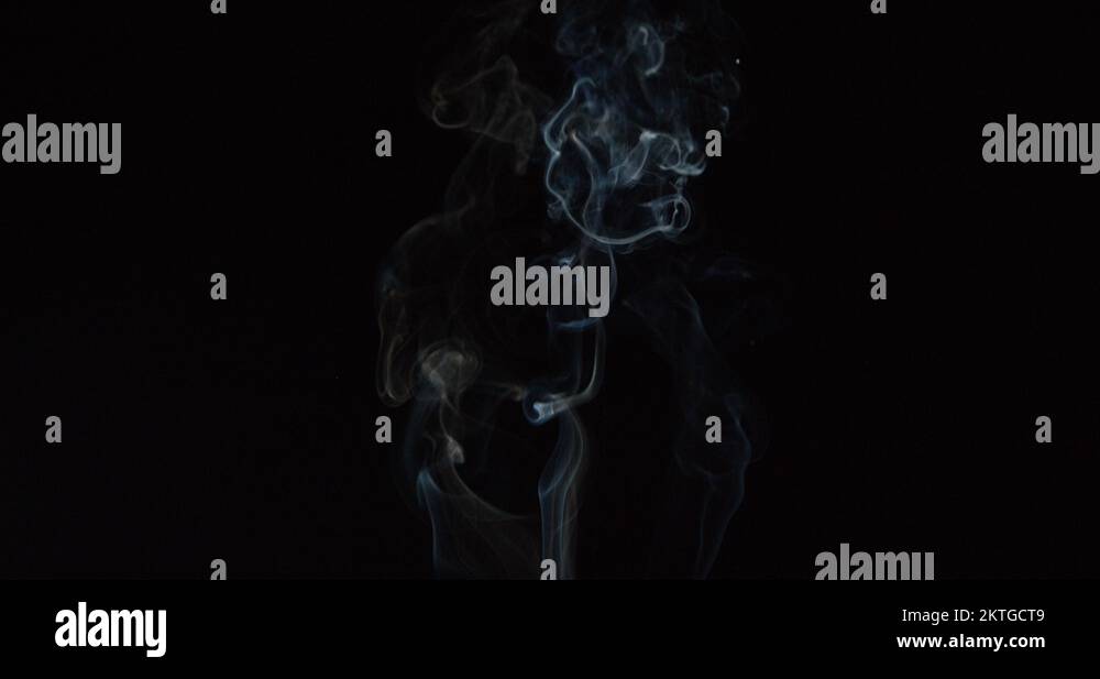 Magical wisps of smoke rise from bottom of frame as if from candle or ...