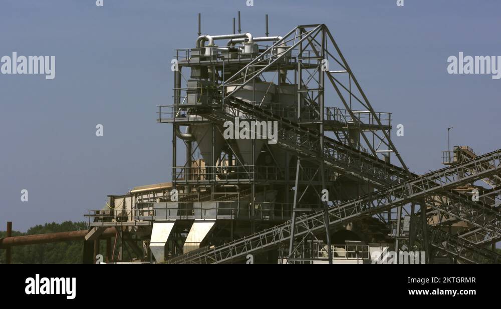 Sand mining installation mixing sand using conveyor belts and silos ...
