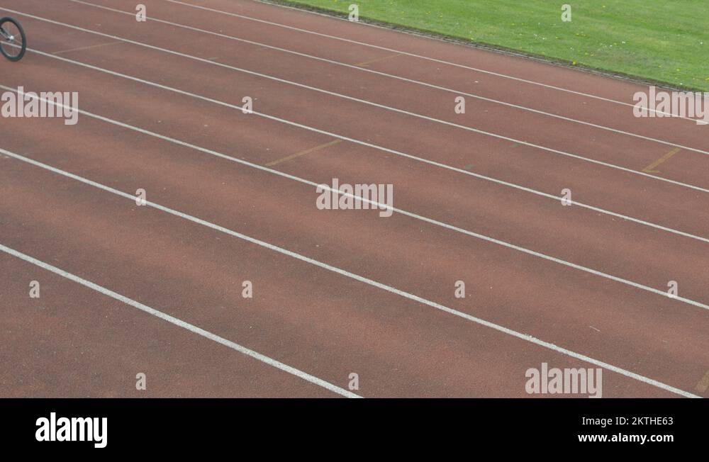 4K Disabled wheelchair athletes competing in a race at race track Stock ...