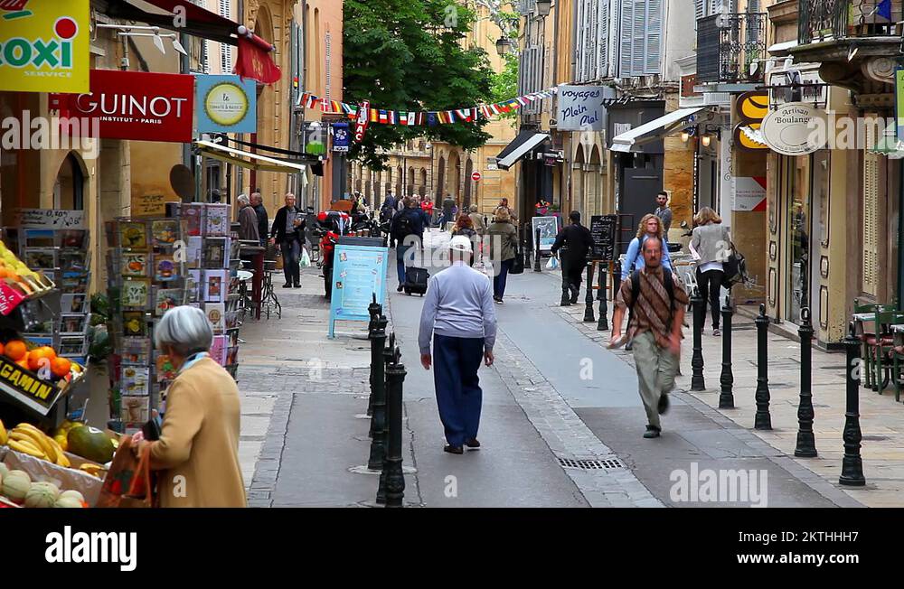 People shop at the most popular historic street in Aix-en-Provence ...