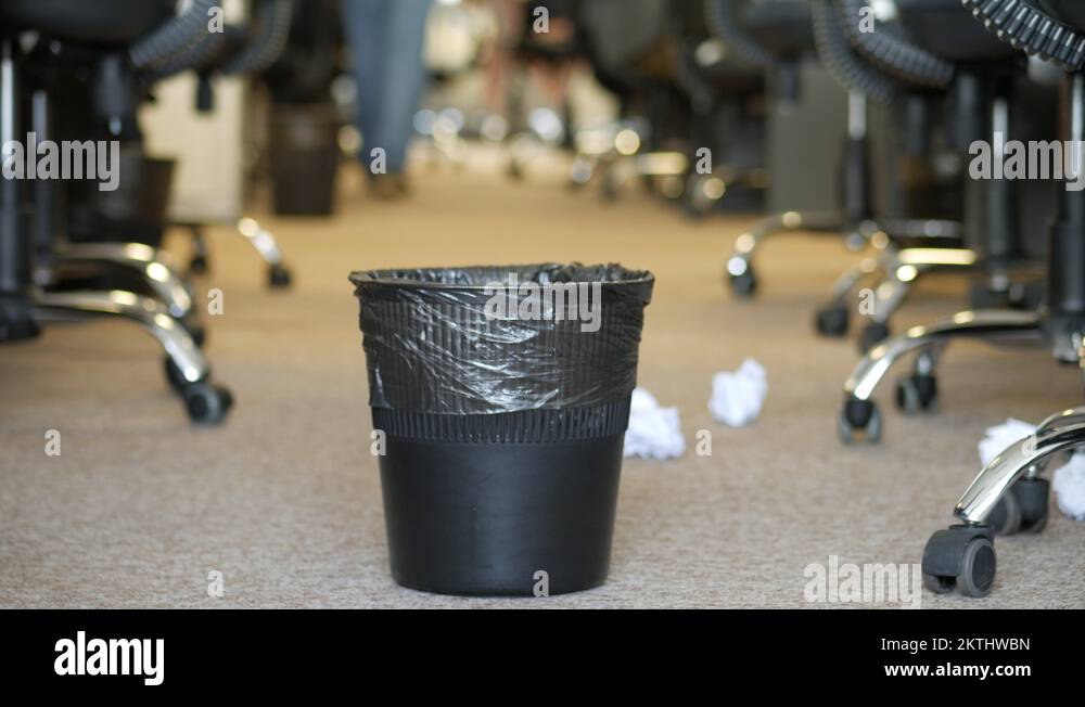 Tossing crushed paper into garbage, 4k UHD 2160p, dolly slider shot ...