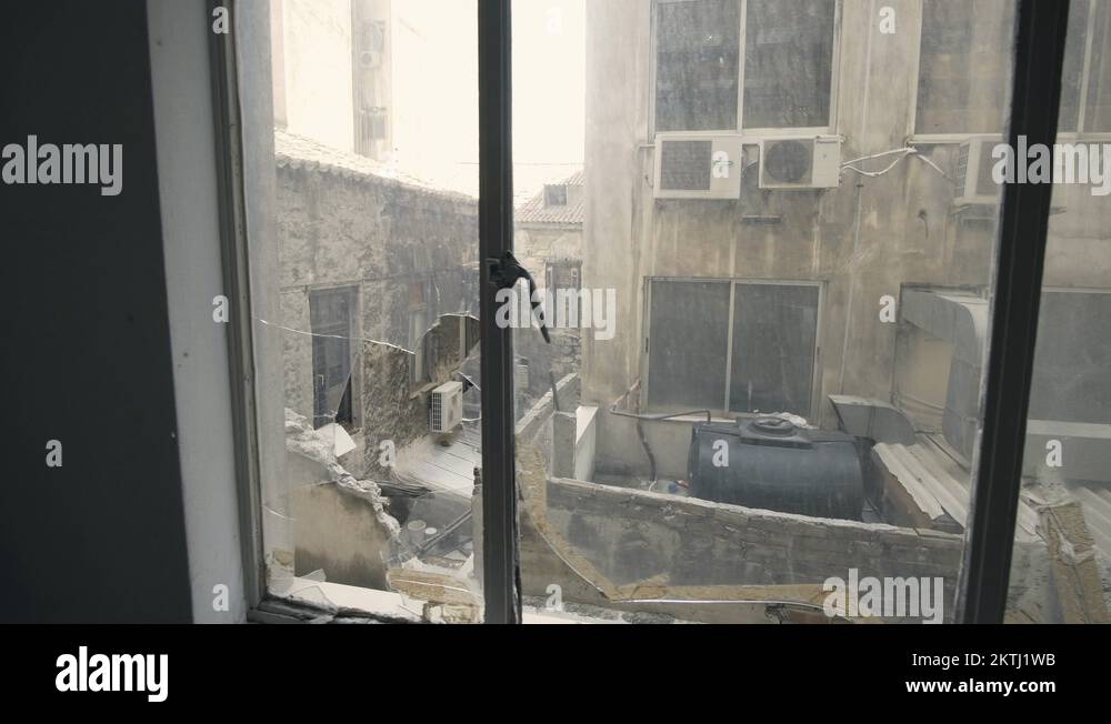 Window view at collapsed, ruined buildings in ghetto city block Stock ...