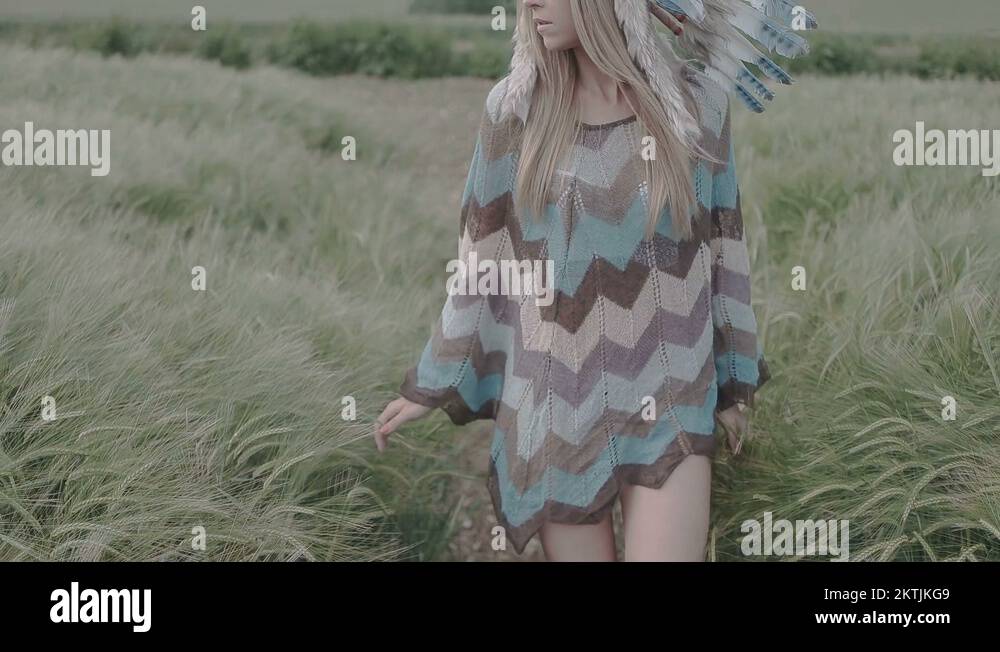 Native American Indian looking beautiful woman walking on the field ...