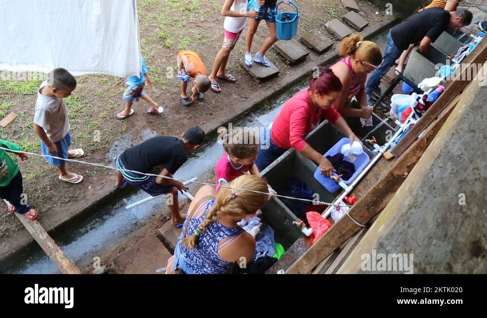 Women Washing Clothes in Line at Cuban Immigrant Facility Stock Video ...