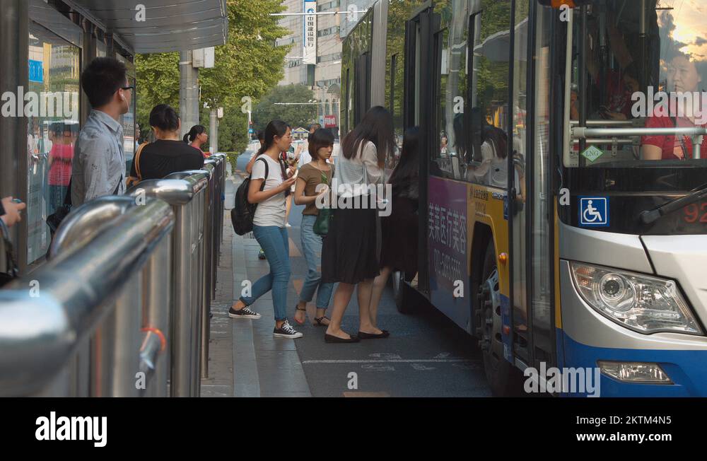 Chinese people running for bus, Beijing Stock Video Footage - Alamy