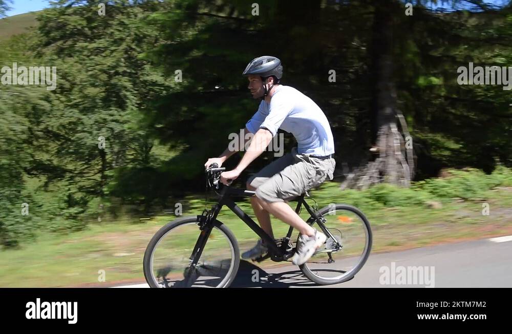 Man riding bike road Stock Videos & Footage - HD and 4K Video Clips - Alamy